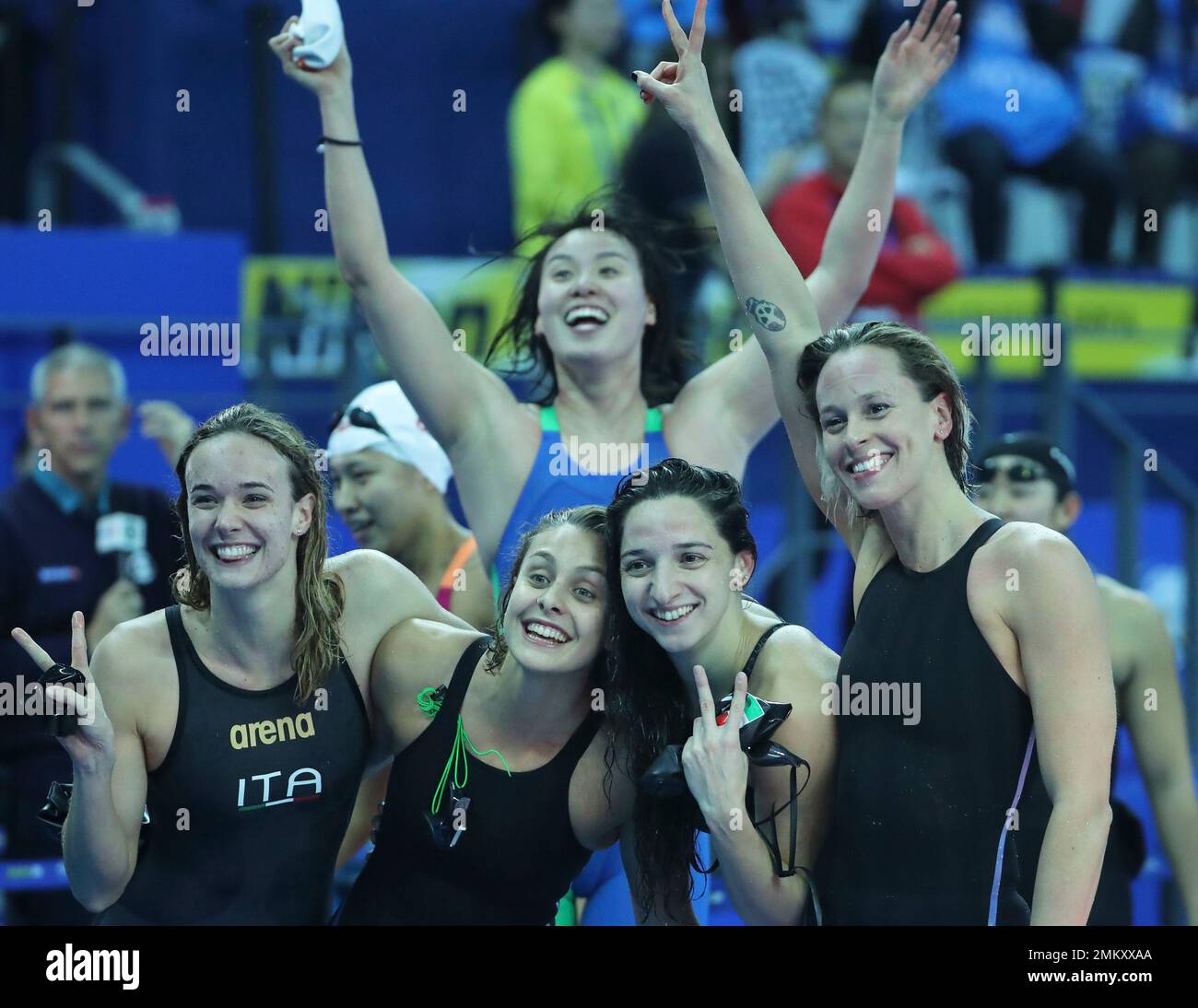 Members of the Italian team pose for pictures after winning bronze at ...