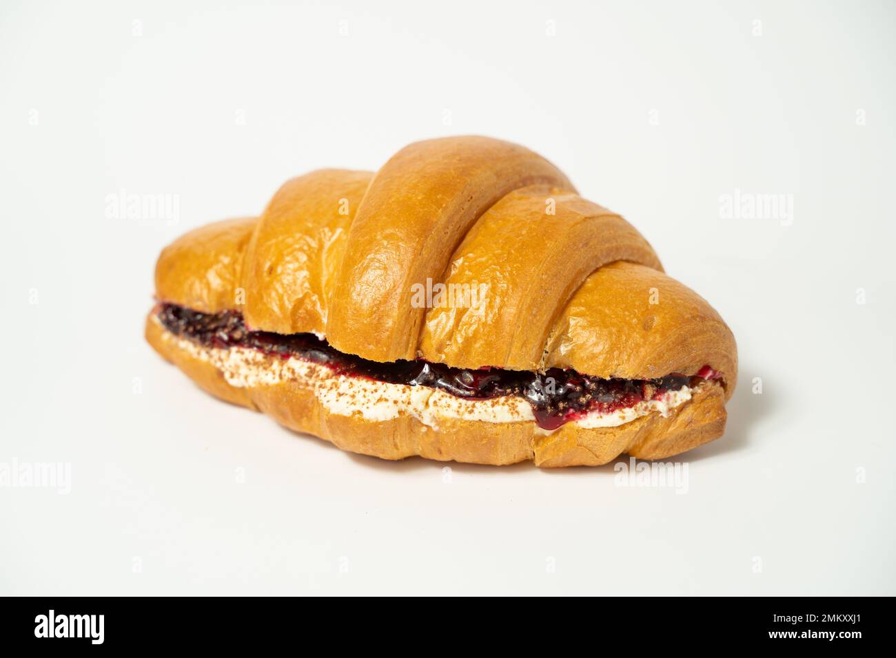 close up photo of a croissant with stuffing on a white background Stock ...
