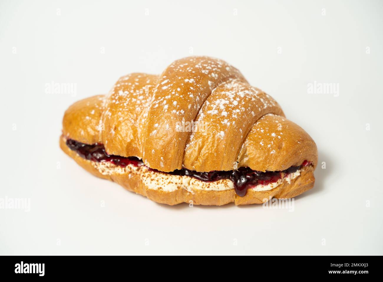 close up photo of a croissant with stuffing on a white background Stock ...