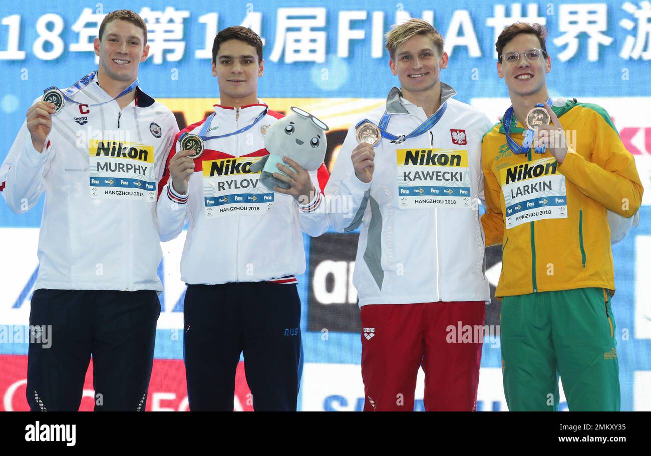 From left, silver medalist USA's Ryan Murphy, gold medalist Russia's ...