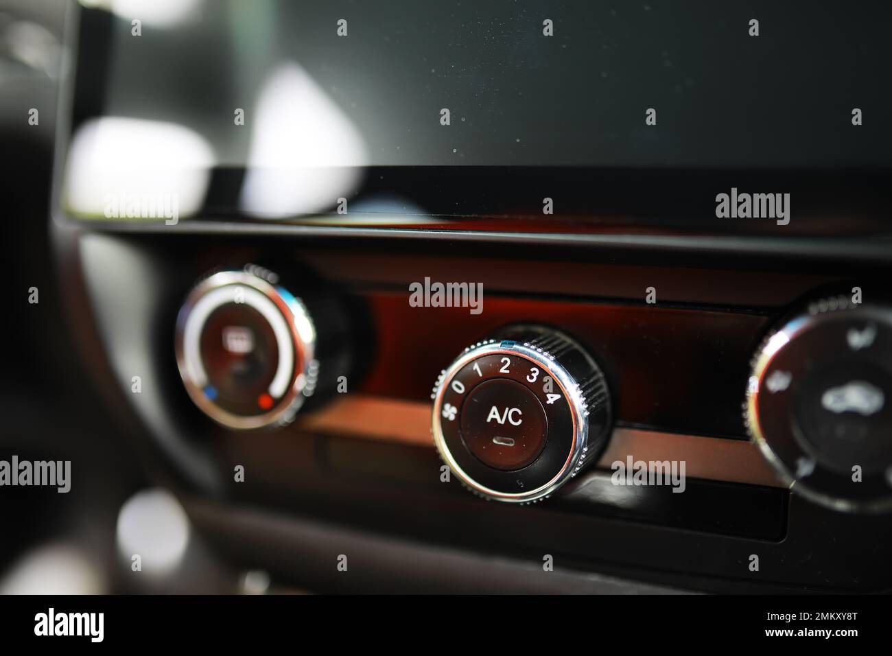 The process of choosing climate control in the car. Man regulating ...