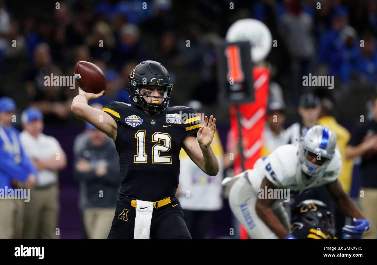 Appalachian State quarterback Zac Thomas (12) passes in the first half ...