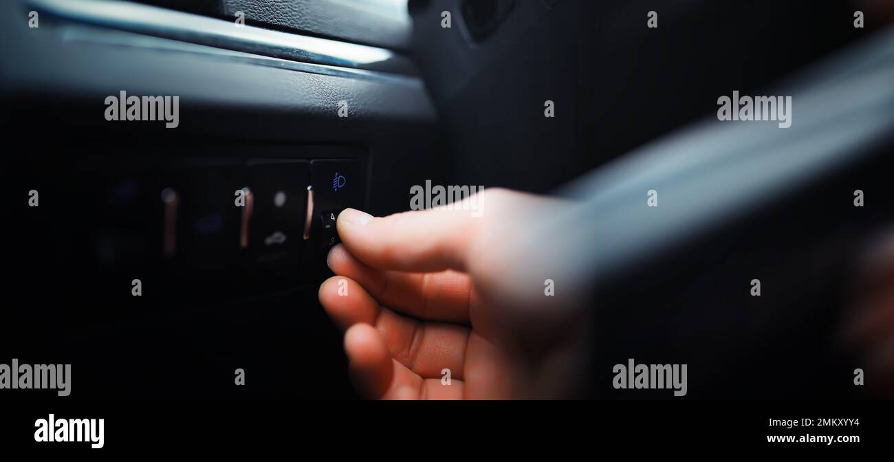 The process of choosing climate control in the car. Man regulating ...