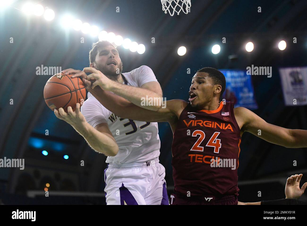 Virginia Tech forward Kerry Blackshear Jr. (24) reaches in against ...