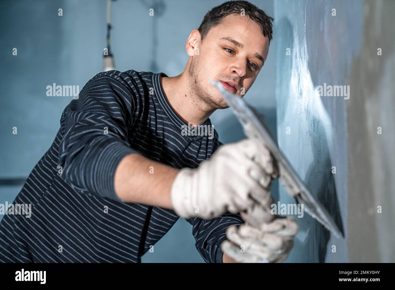 manual application of waterproofing to the wall on the construction ...