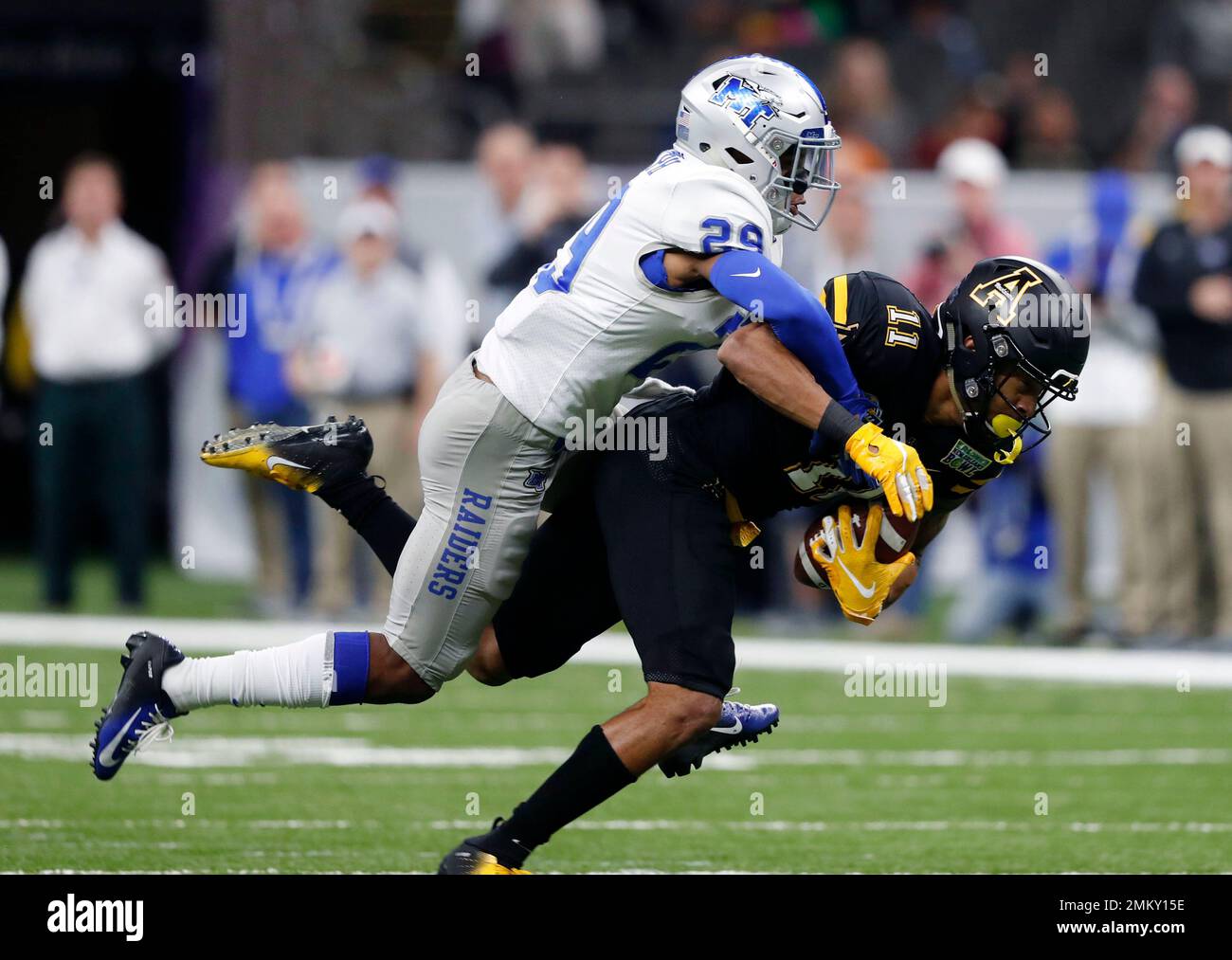 Appalachian State wide receiver Jalen Virgil (11) is tackled by Middle ...