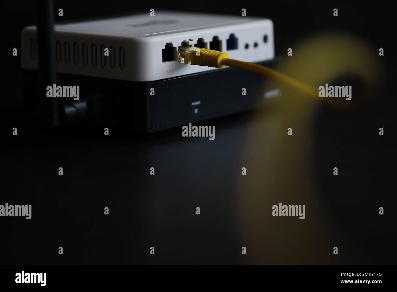 Modern dual band wireless router. Man working in the background. Fast ...