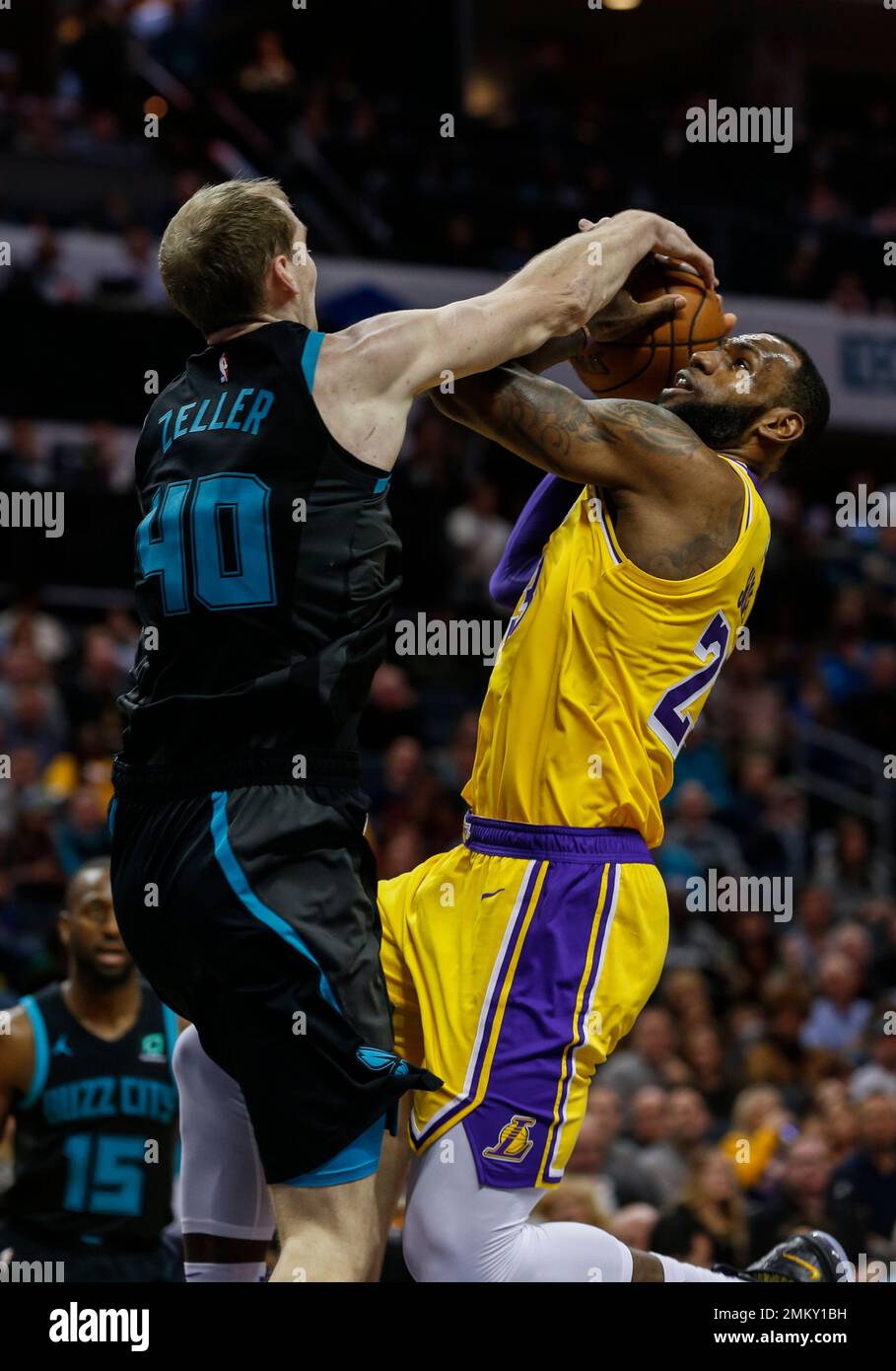 Charlotte Hornets center Cody Zeller, left, blocks the shot of Los ...