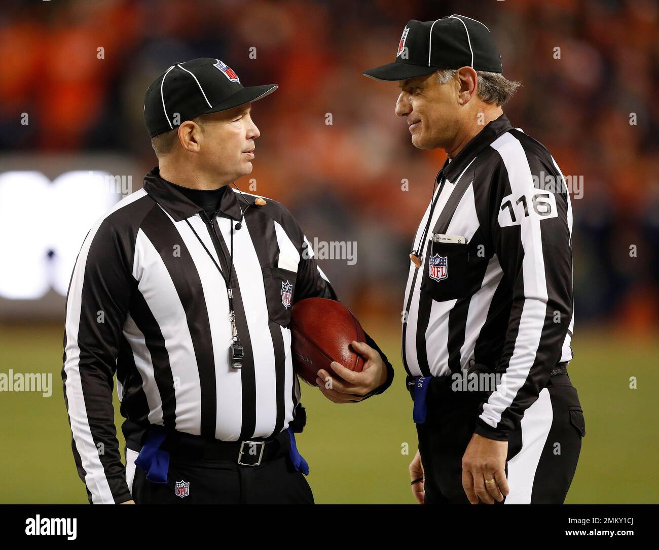 field judge Mike Weatherford (116) speaks with an official during the ...