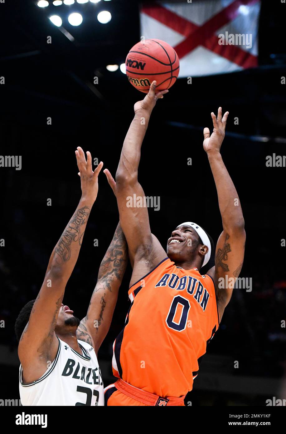 Auburn forward Horace Spencer (0) shoots over UAB forward Lewis ...