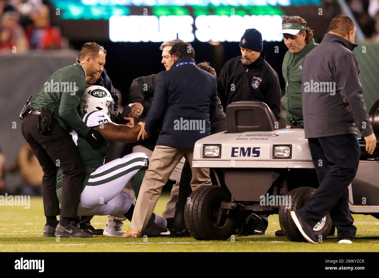 New York Jets offensive tackle Brandon Shell (72) is helped onto a cart ...