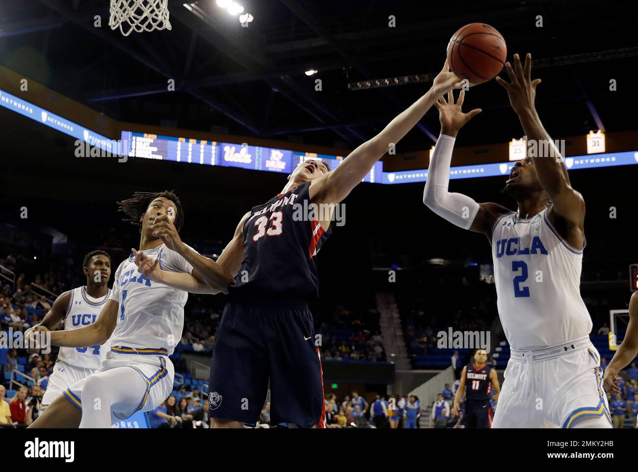 Belmont center Nick Muszynski (33) works for a rebound against UCLA ...