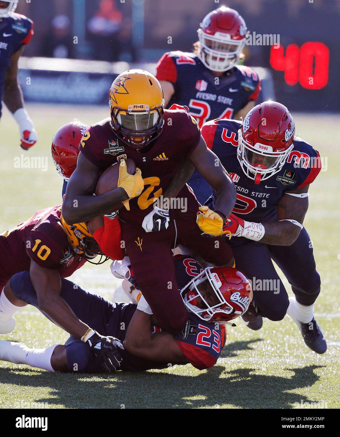 Arizona State wide receiver Brandon Aiyuk is tackled after making a ...