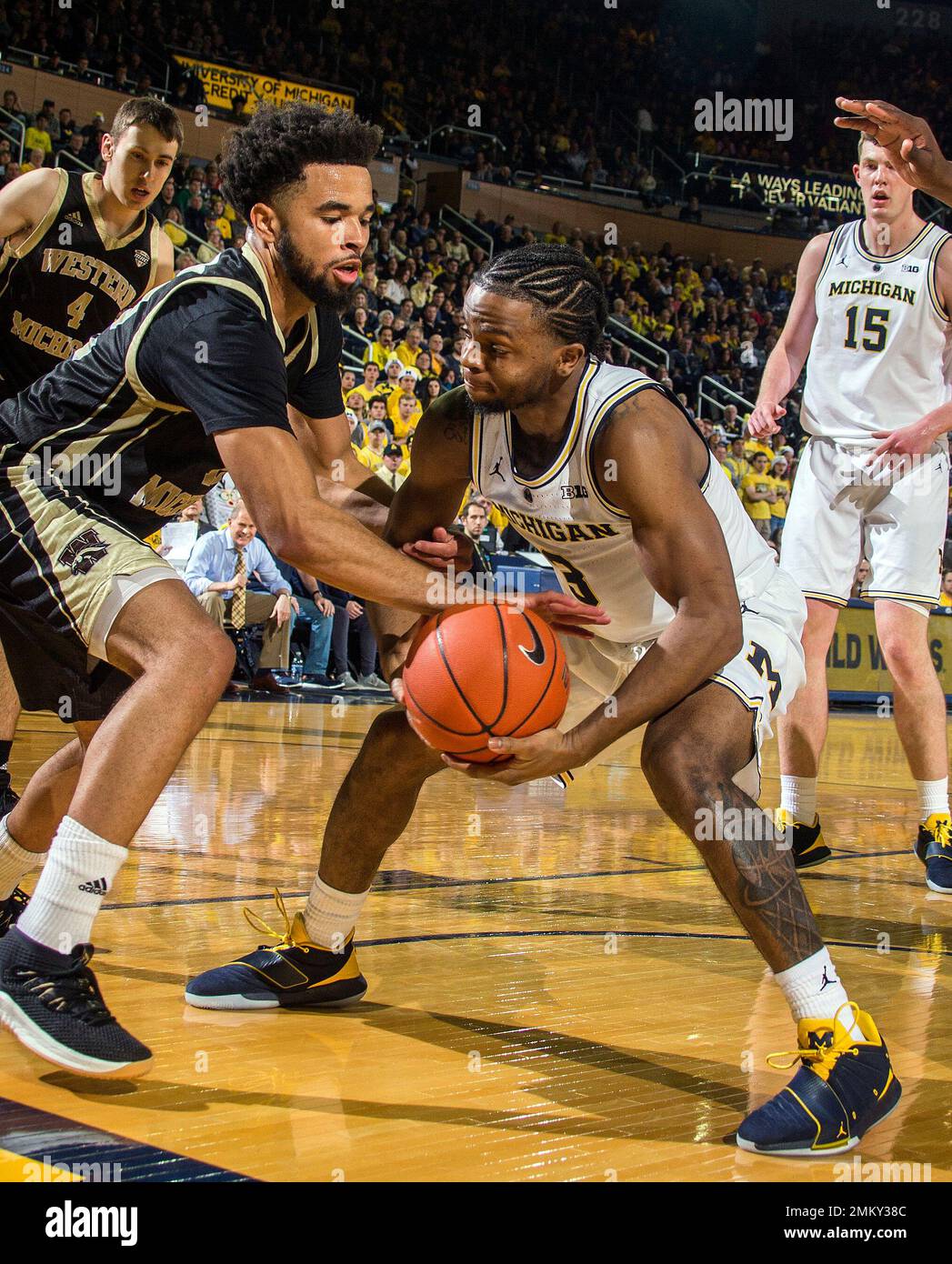 Western Michigan guard Michael Flowers, left, attempt to force a ...
