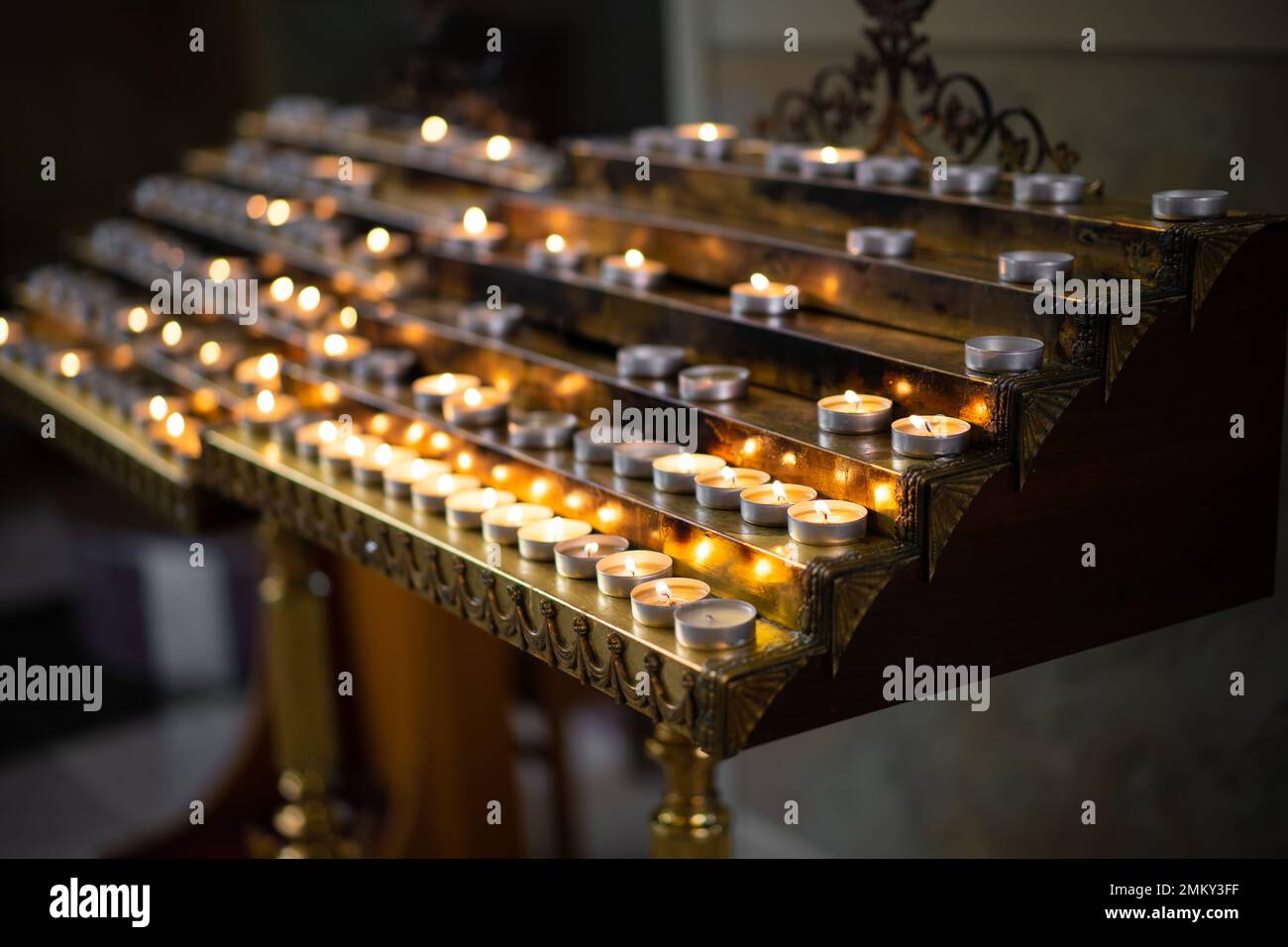 many candles in the church Stock Photo - Alamy
