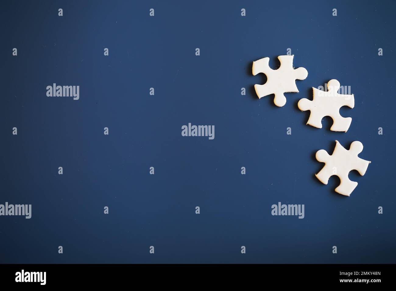 Clean puzzle elements on the background. Empty puzzle piece on table ...