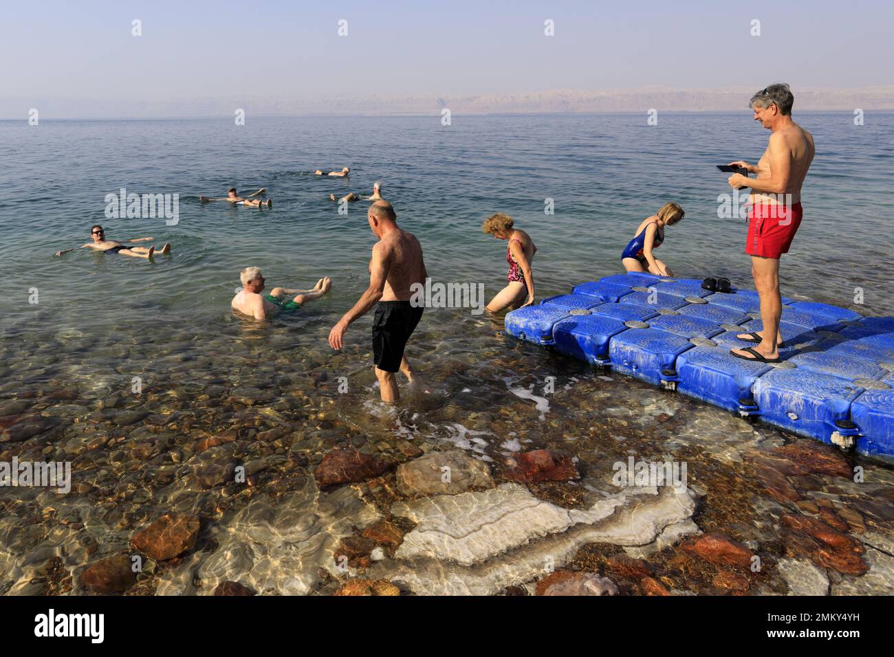 People swimming in the Dead Sea, the OH Beach hotel and resort, Jordan ...