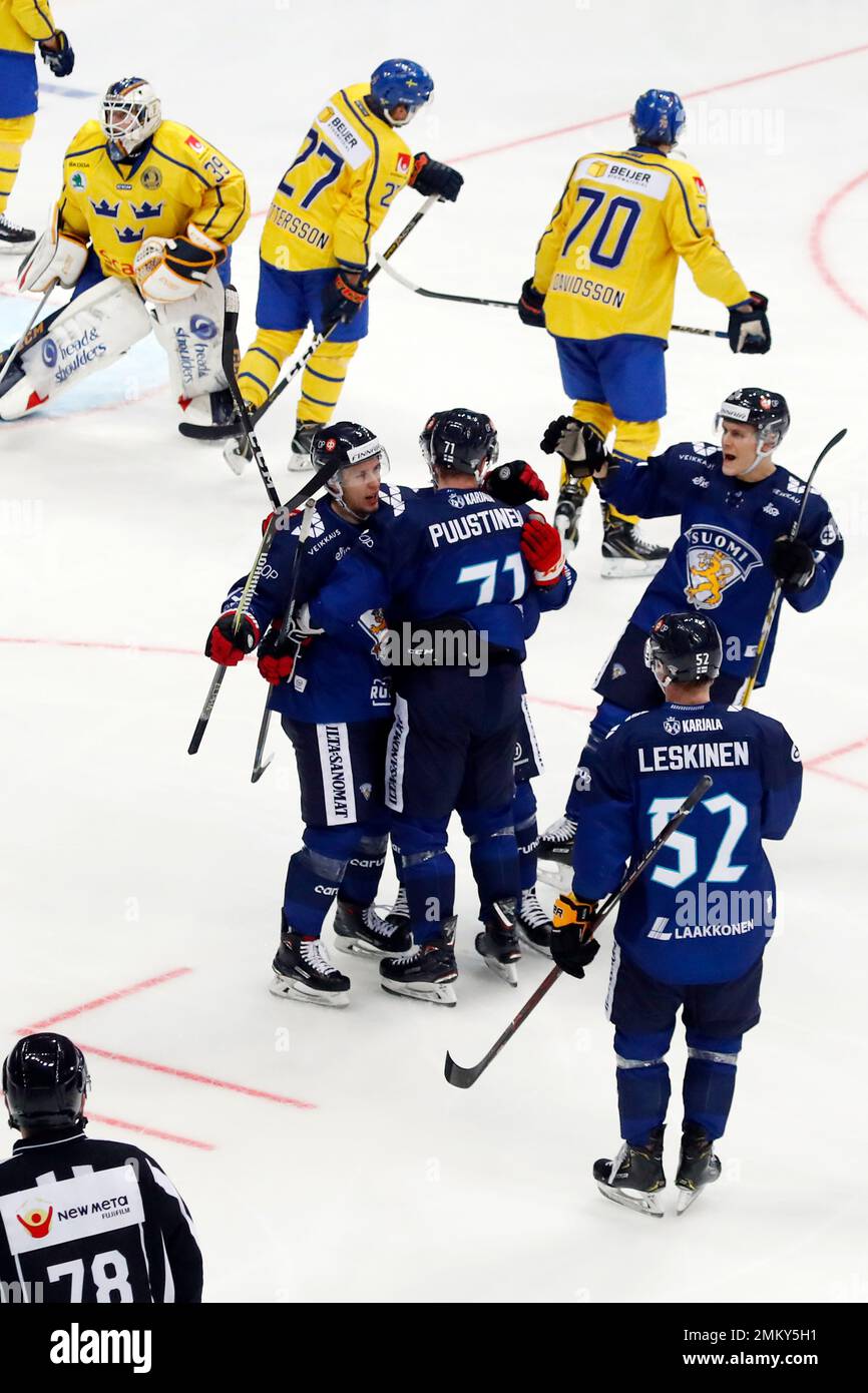 Sweden's team players, center, celebrate after scoring their side's ...