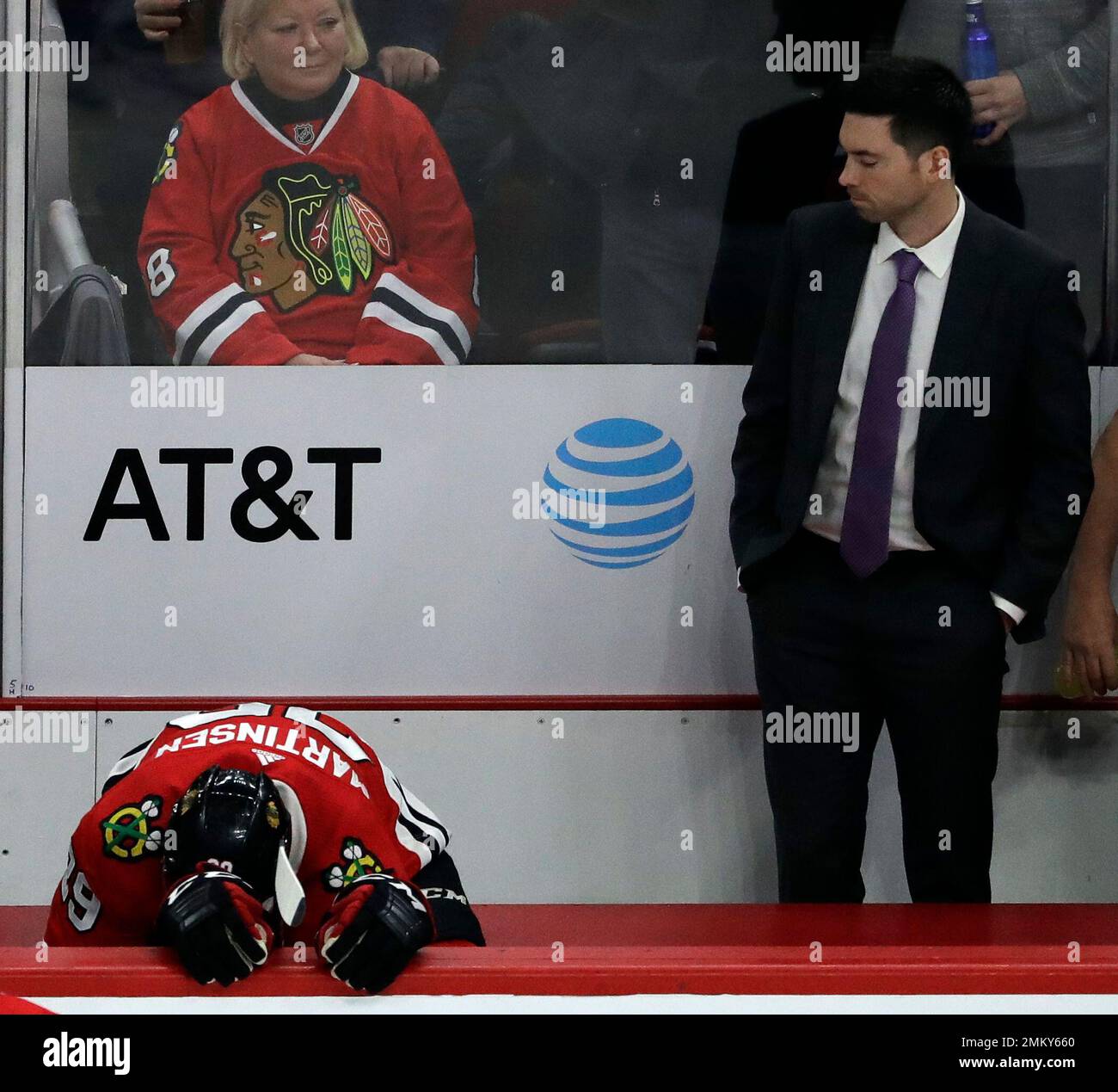 Chicago Blackhawks left wing Andreas Martinsen, front left, and head ...