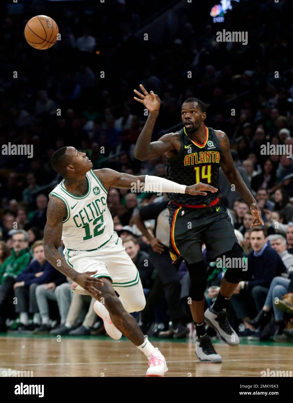 Atlanta Hawks center Dewayne Dedmon (14) passes the ball over Boston ...