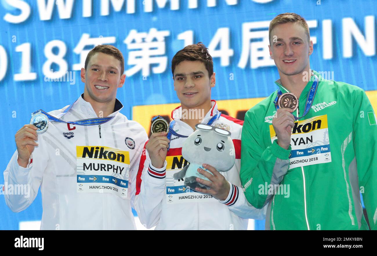 From left, silver medalist USA's Ryan Murphy, gold medalist Russia's ...