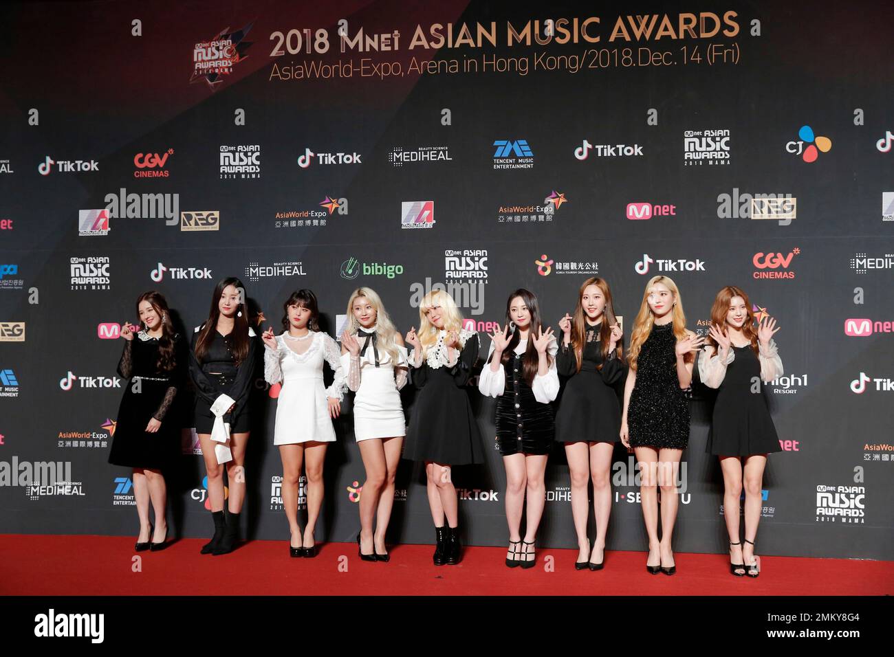 Members of South Korean music band IZ*ONE pose for photos on the red ...