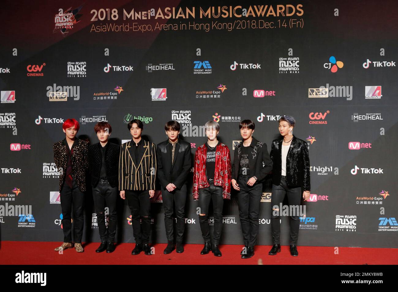 Members of South Korean music band BTS pose for photos on the red ...