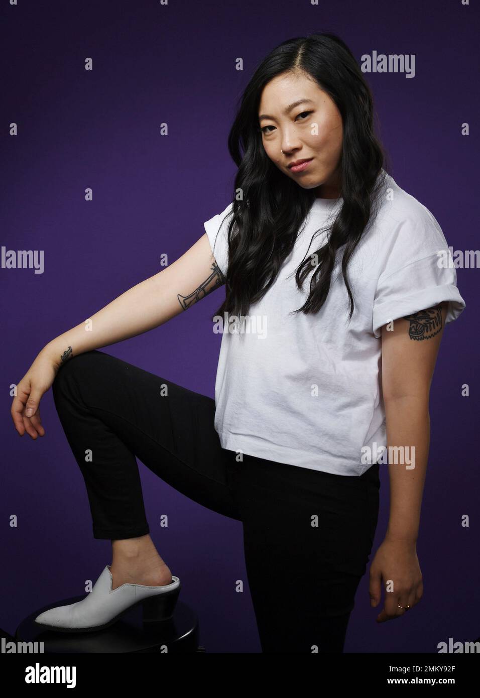 In this Dec. 5, 2018 photo, actress-rapper Awkwafina poses for a ...