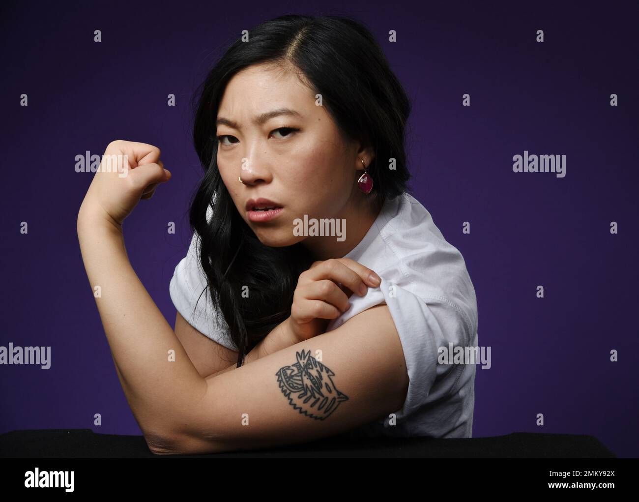 In this Dec. 5, 2018 photo, actress-rapper Awkwafina poses for a ...