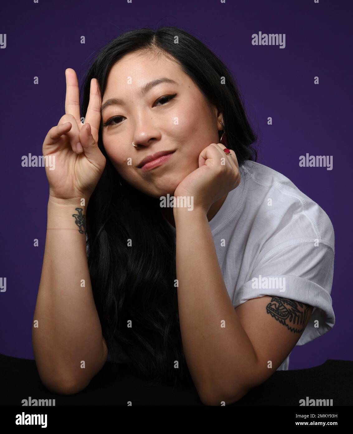 In this Dec. 5, 2018 photo, actress-rapper Awkwafina poses for a ...