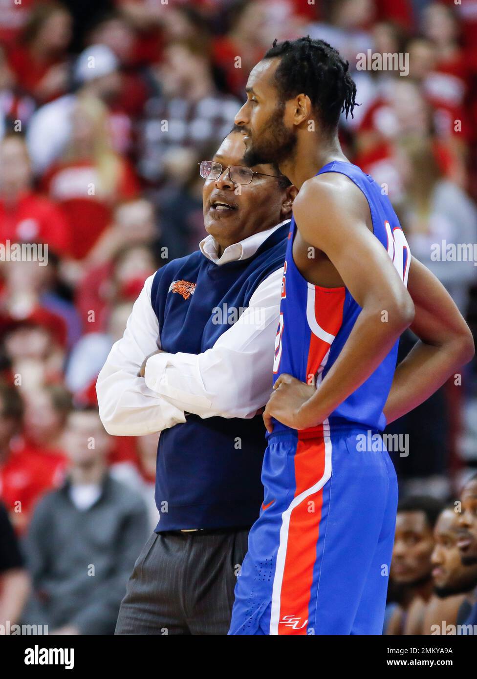 Savannah State head coach Horace Broadnax talks with Tyrell Harper ...