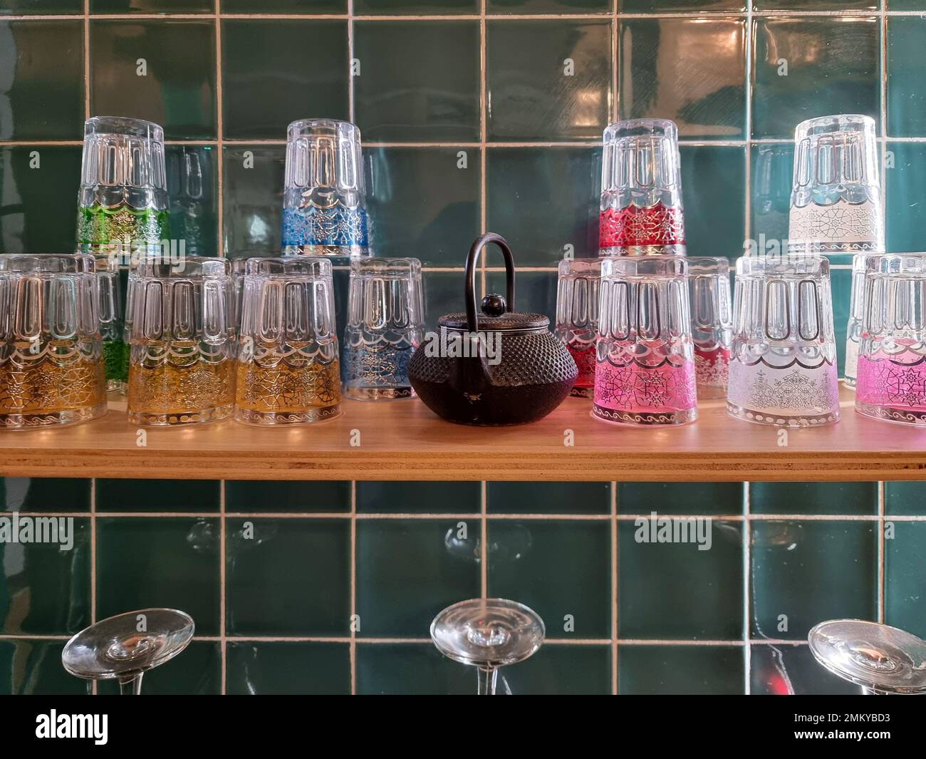 Arabic style tea glasses next to an iron teapot Stock Photo - Alamy