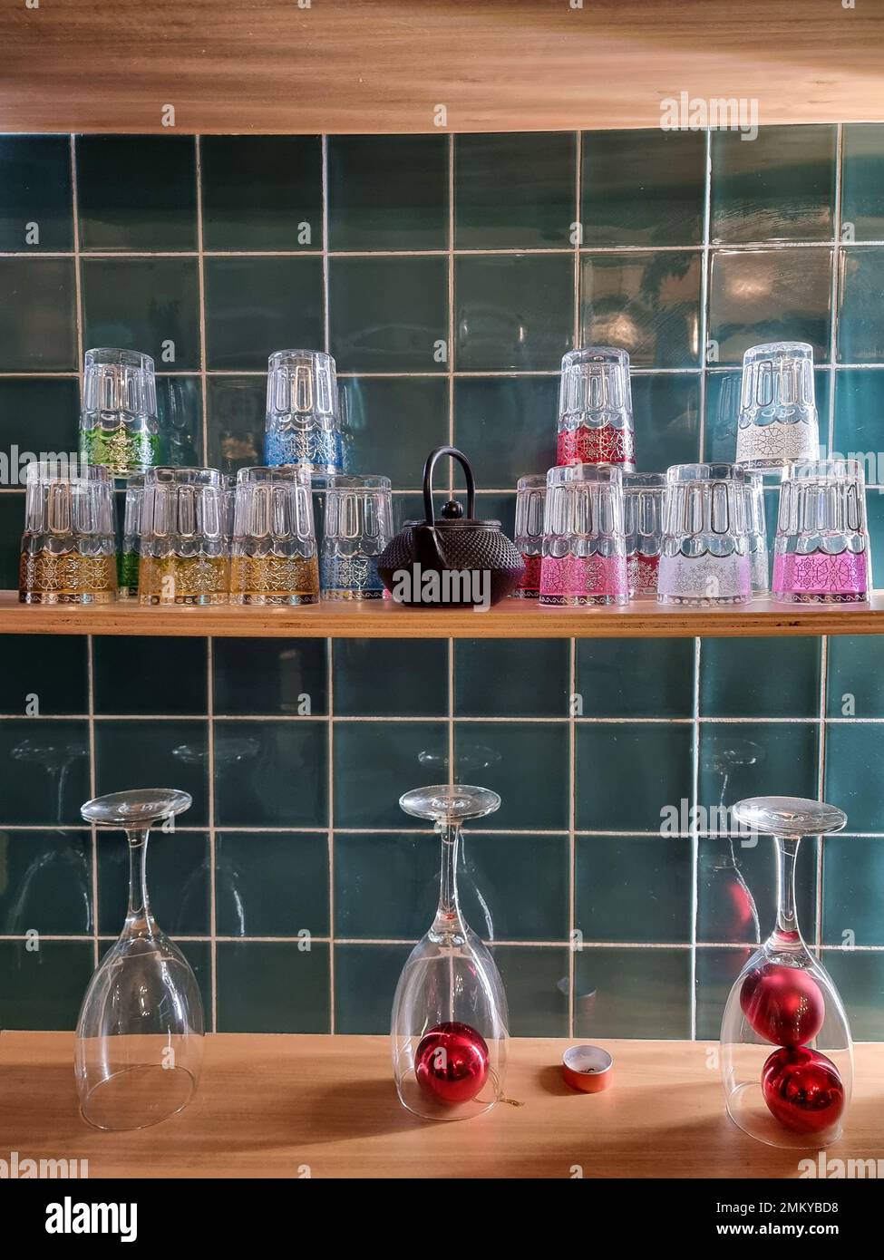 Arabic style tea glasses next to an iron teapot Stock Photo - Alamy