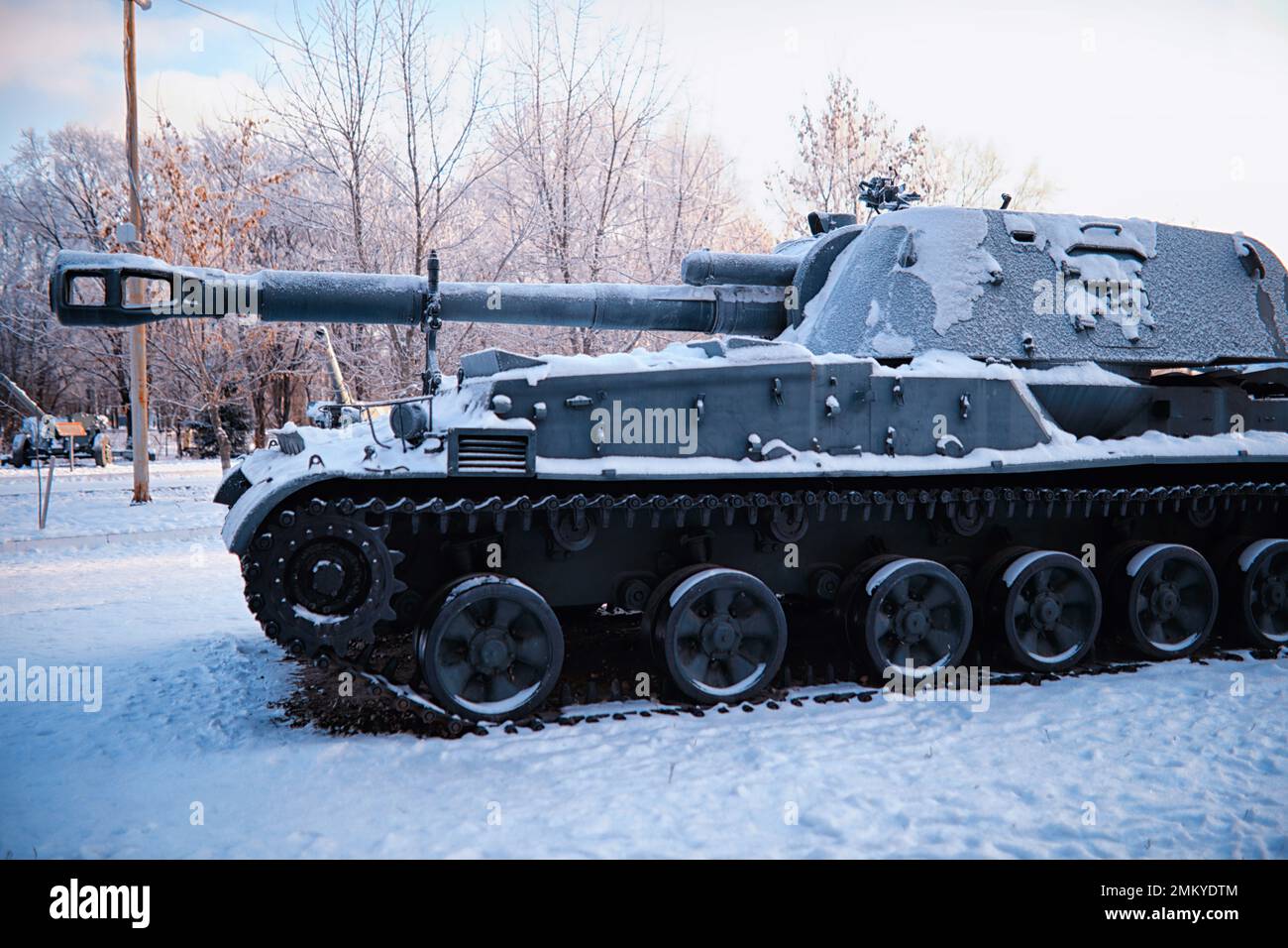 Military tank in a row. Battle tank in the snow on the roadside of ...