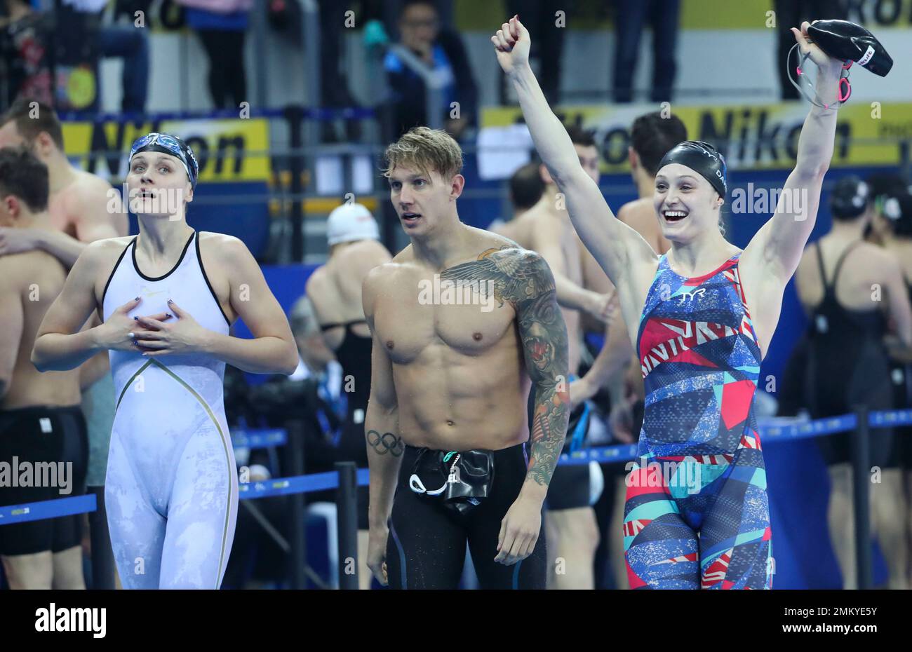 USA team, from left, Olivia Smoglia, Caeleb Dressel and Kelsi Dahlia ...