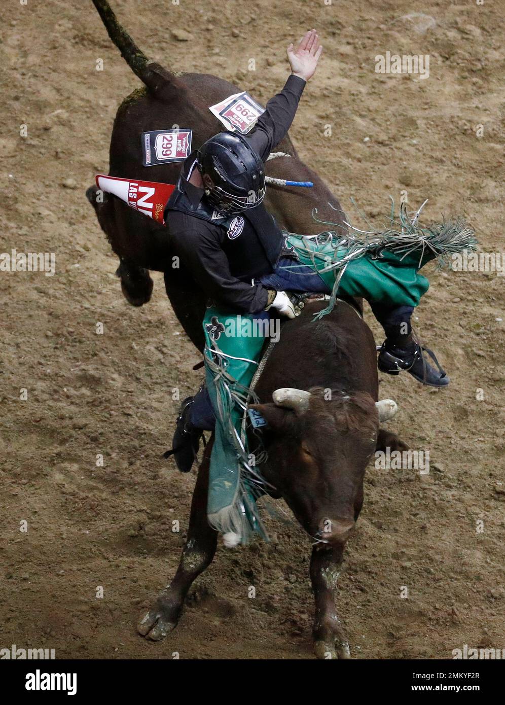 Jeff Askey, of Athens, Texas, competes in the bull riding event during ...