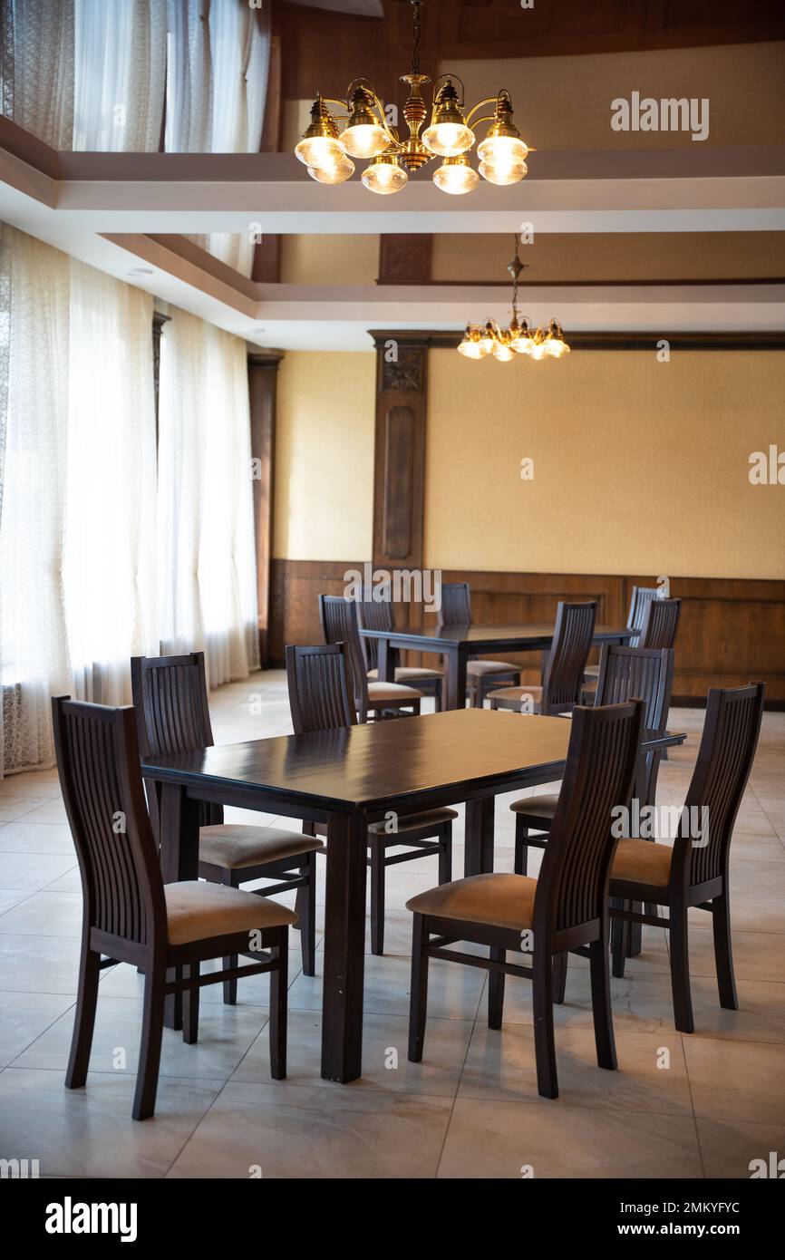 spacious interior of modern empty large restaurant with tables and ...