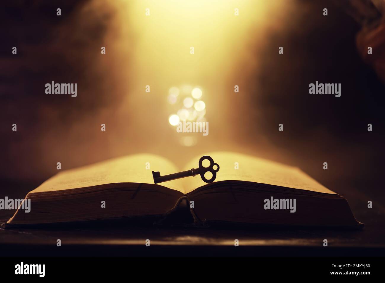 Book on a wooden table background with copy space. Historical ...