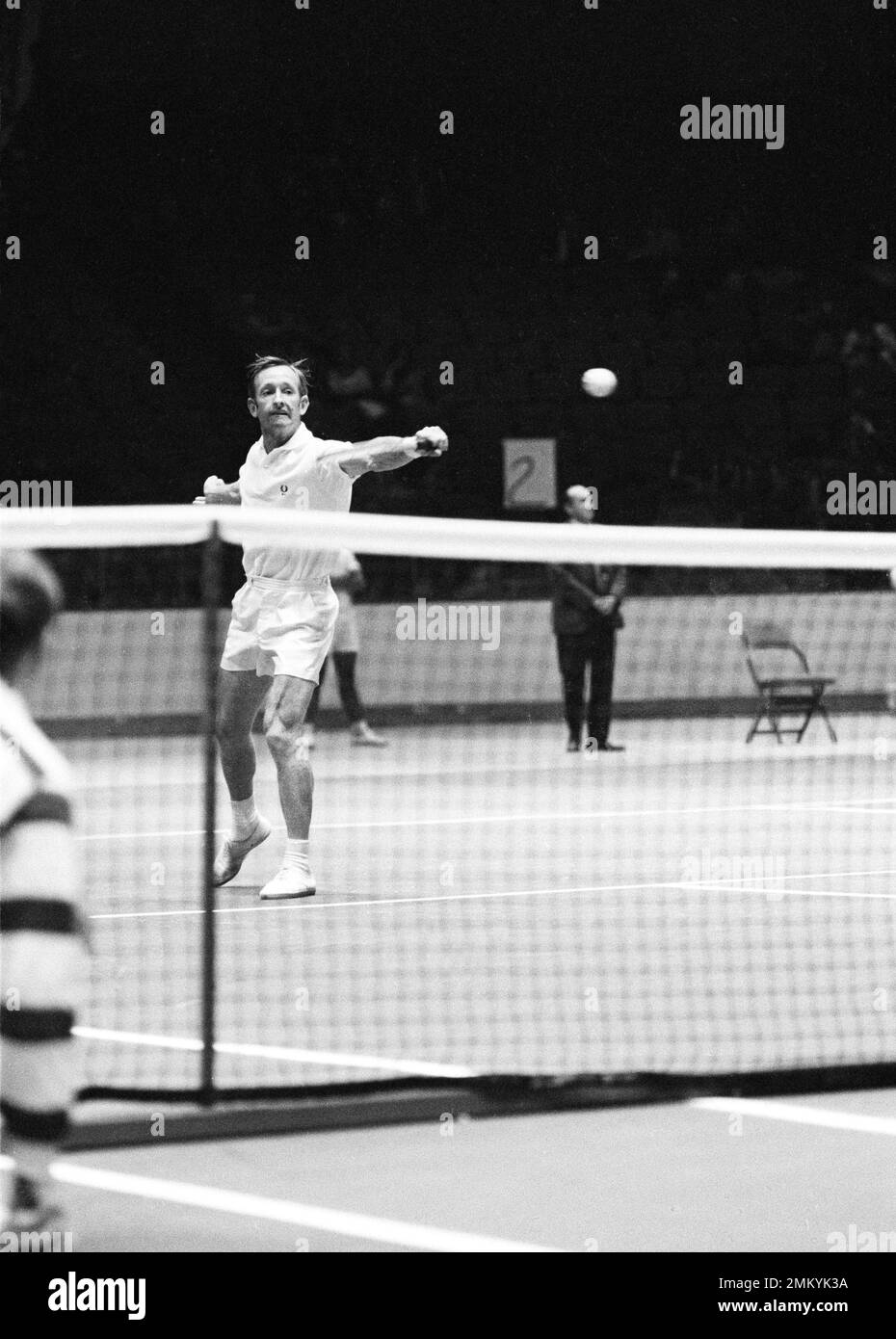 Rod Laver, Wimbledon and Australia Open champion returns a serve ...