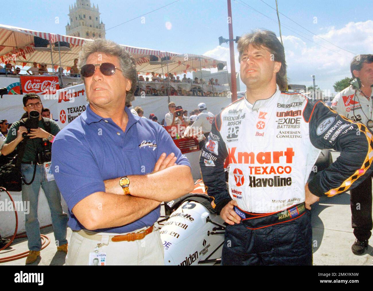 Mario Andretti, left, stands with his son Michael on the track of the ...