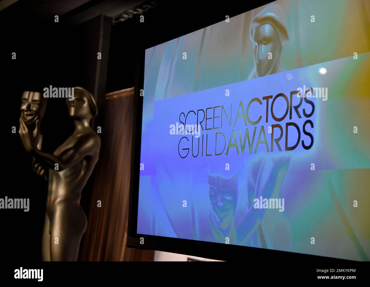 A Screen Actors Guild statue appears alongside a screen on stage at the ...