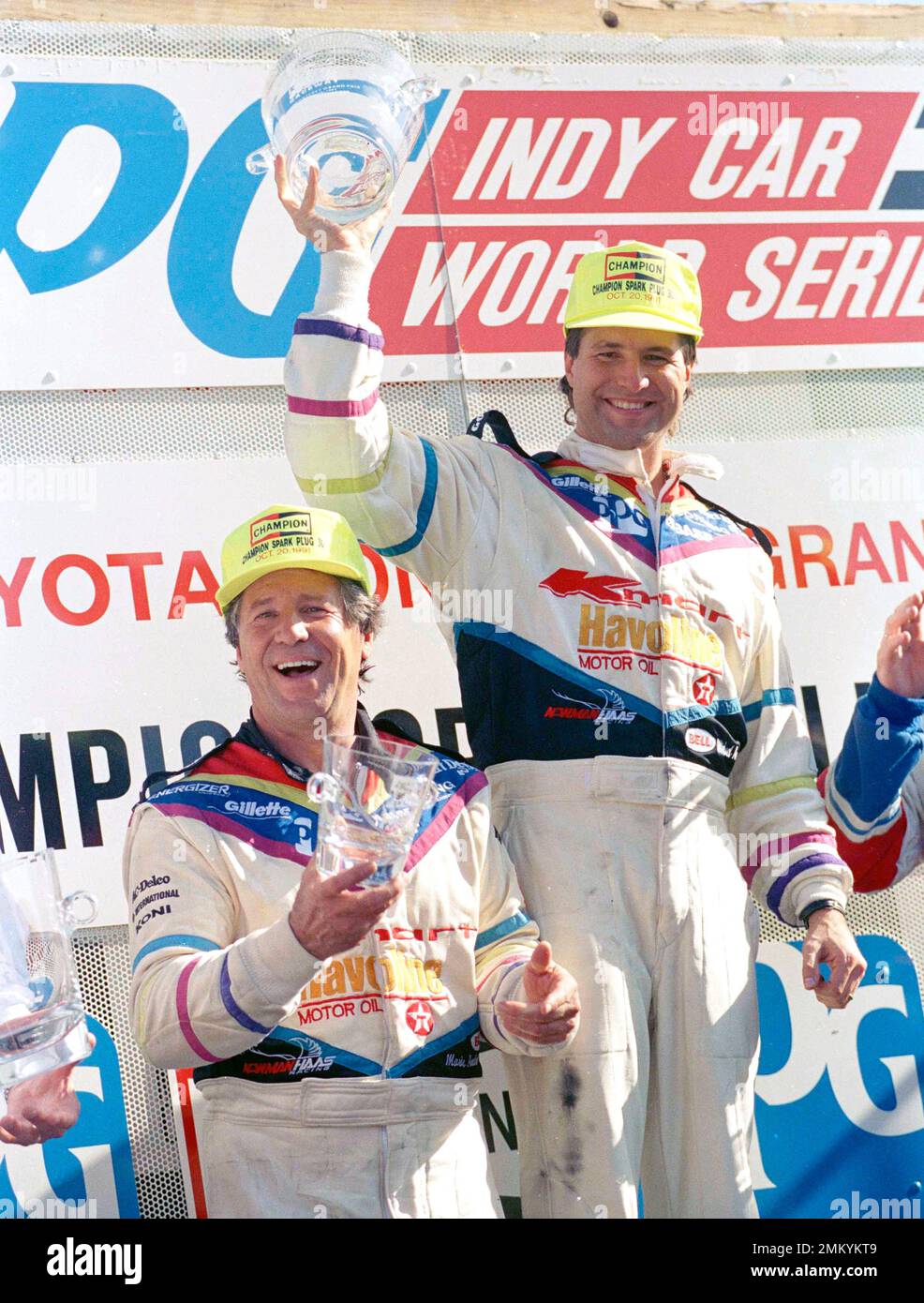 Racing legend Mario Andretti, left, and his son Michael celebrate ...