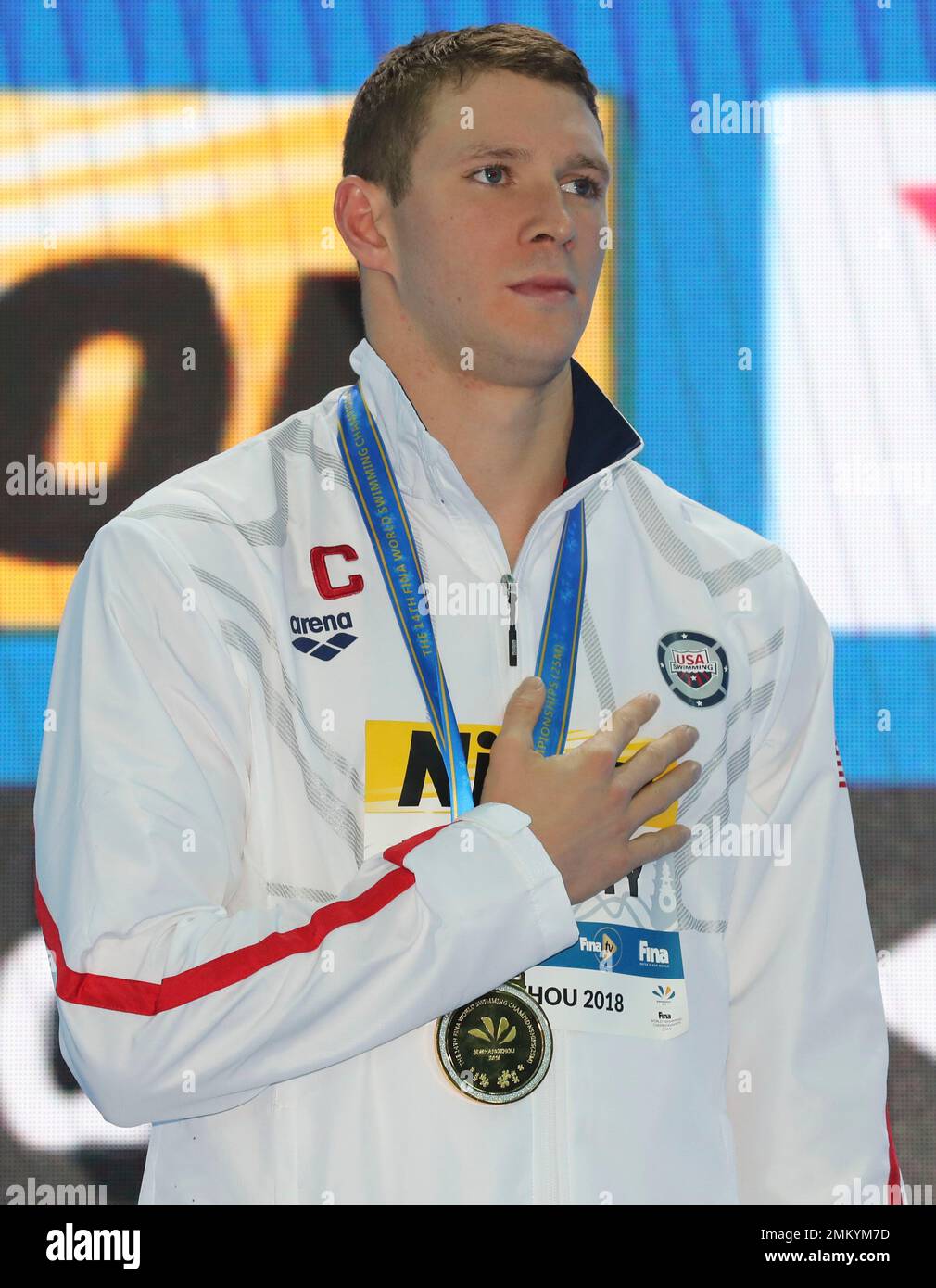 Gold medalist USA's Ryan Murphy stands as their national anthem is ...