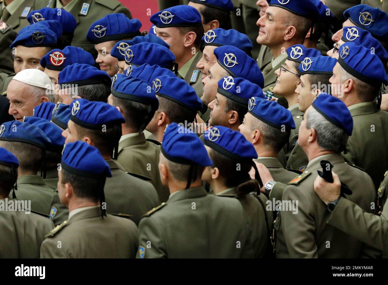 Pope Francis poses for a family picture with a group of Italian Army ...