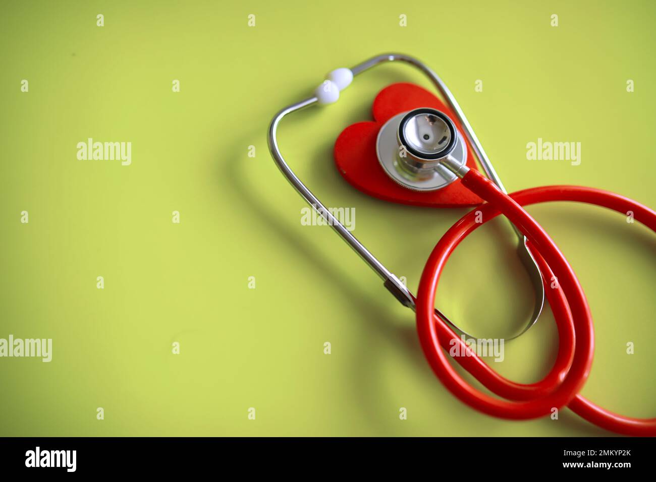 Doctor at his desk in the clinic's office. Stethoscope, test tubes ...