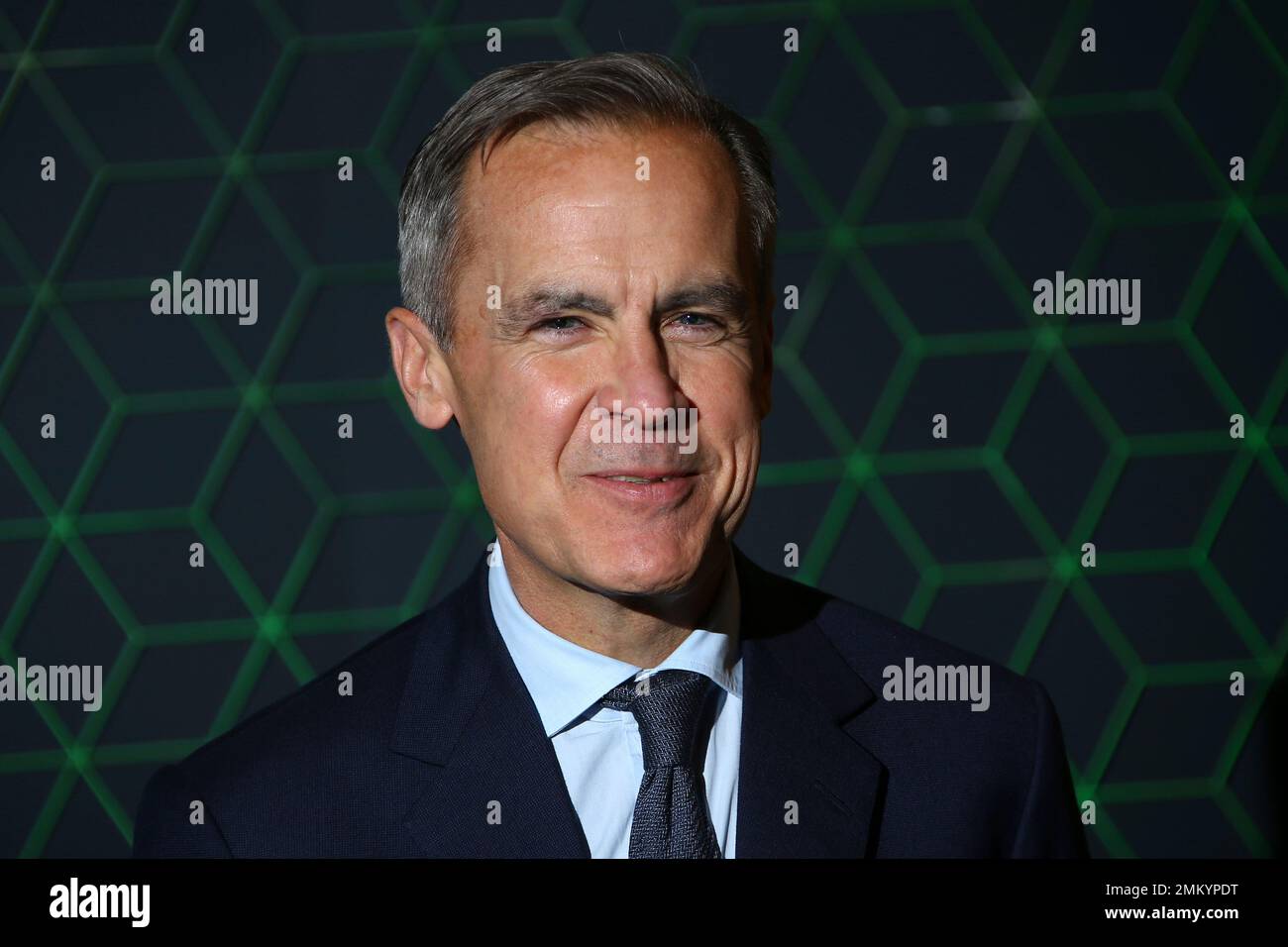 Mark Carney poses for photographers upon arrival at the Bloomberg and ...