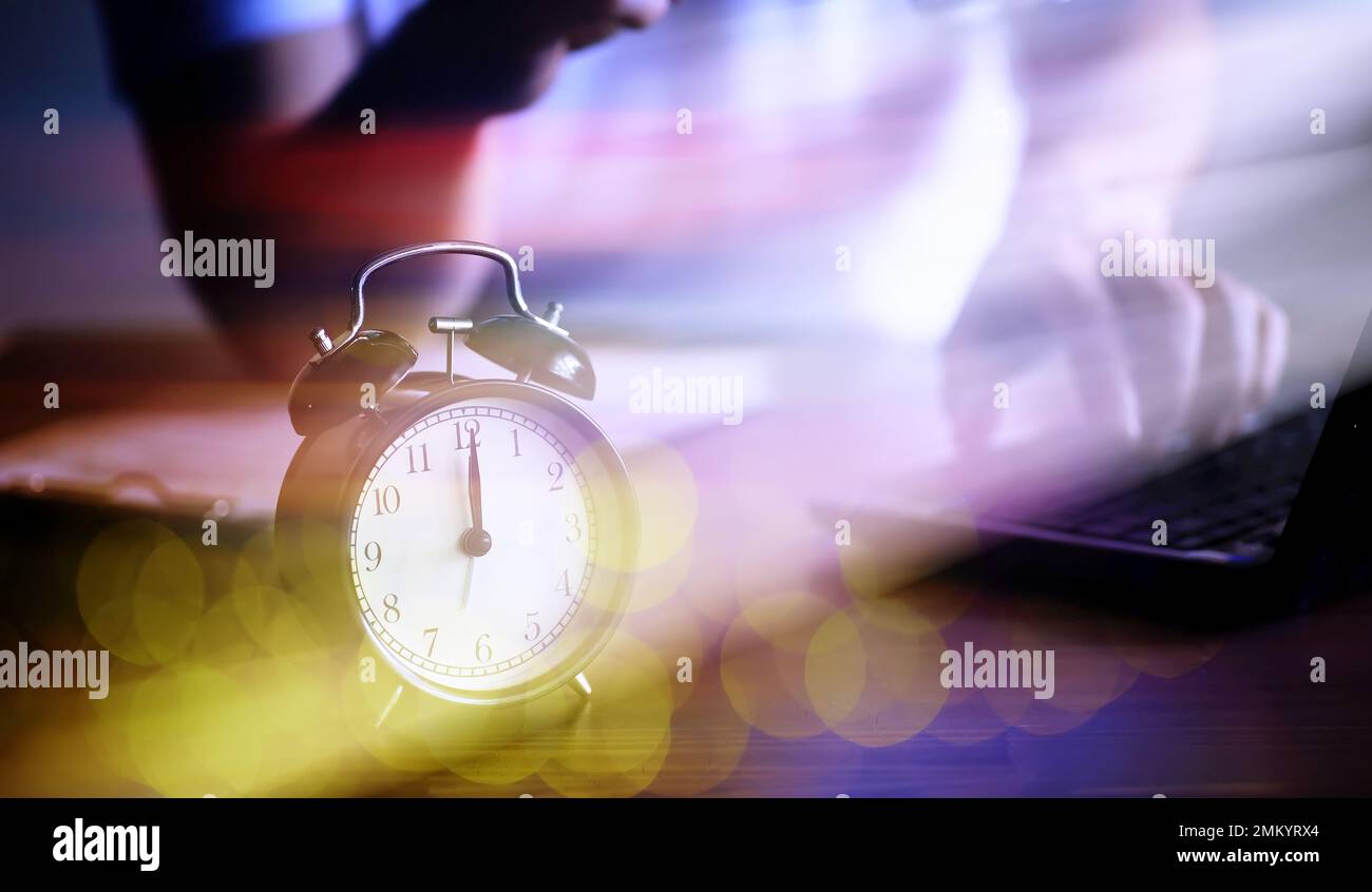 Alarm clock on the table. Time concept. Being late for work school ...