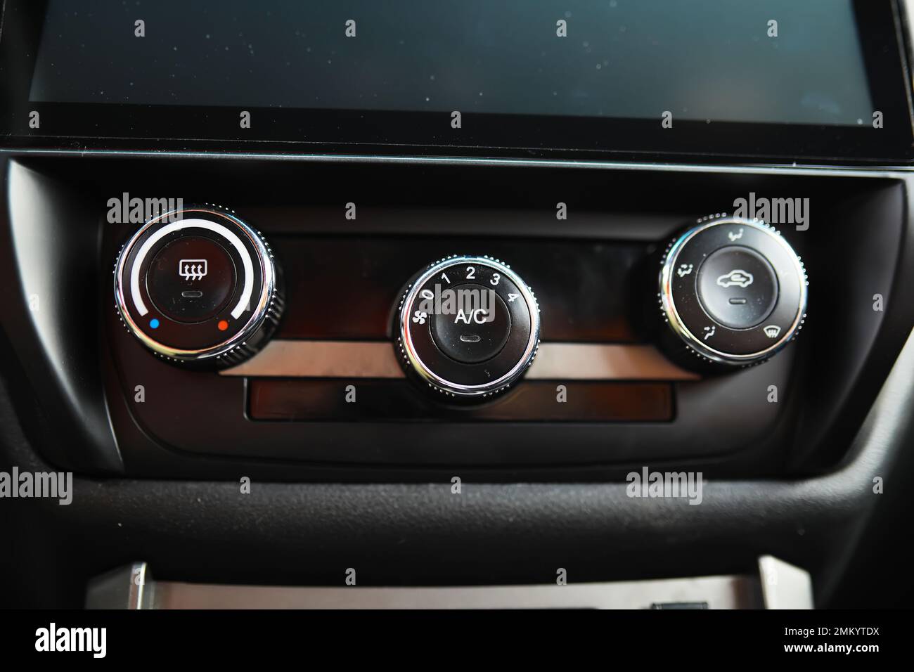 The process of choosing climate control in the car. Man regulating ...