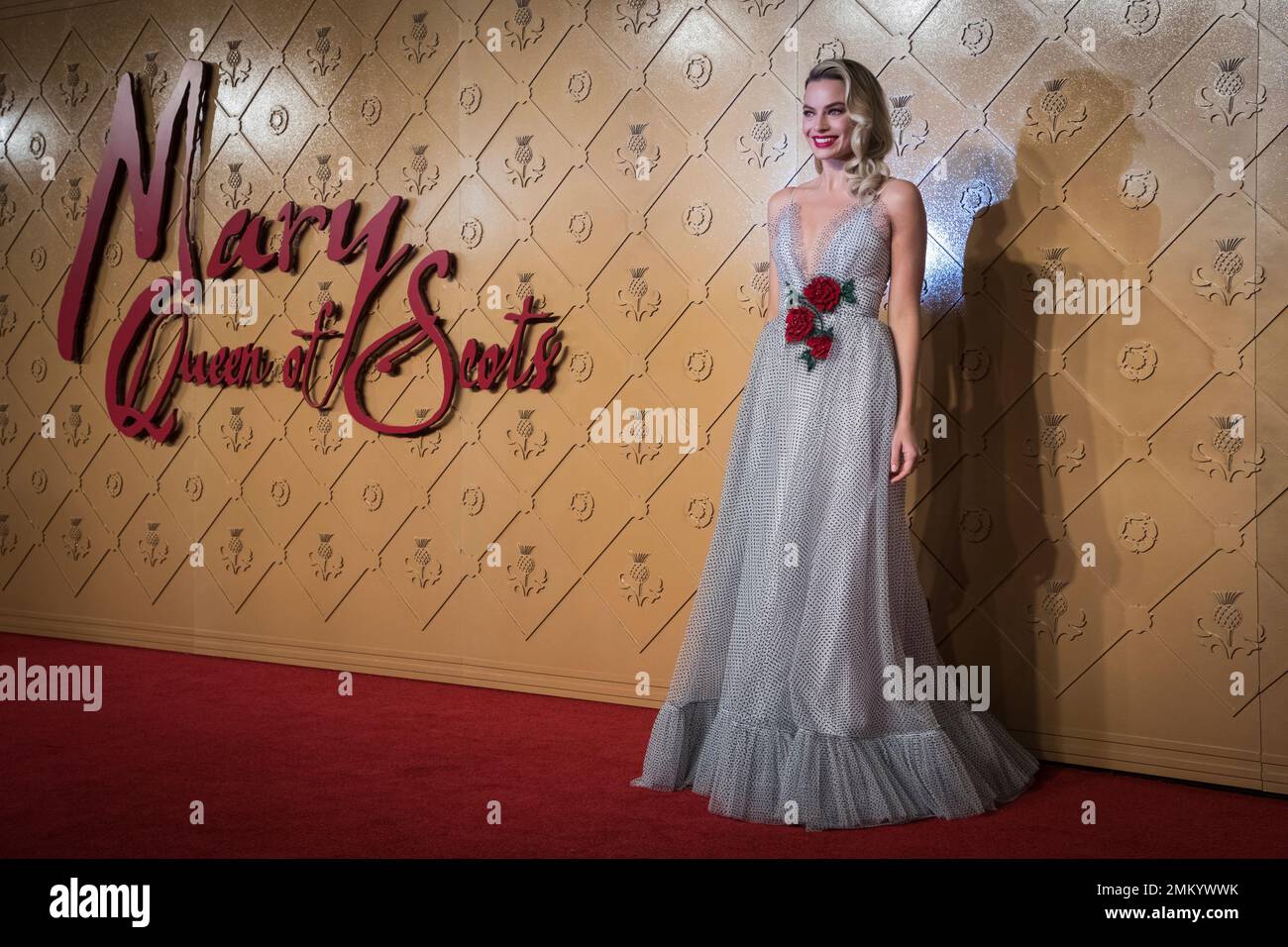 Actress Margot Robbie poses for photographers upon arrival at the ...
