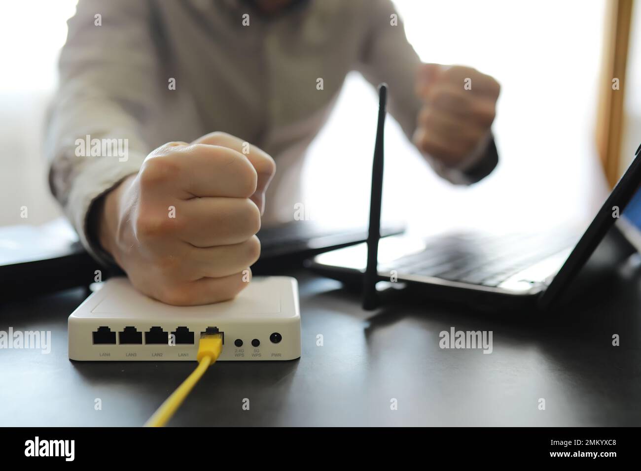 Modern dual band wireless router. Man working in the background. Fast ...